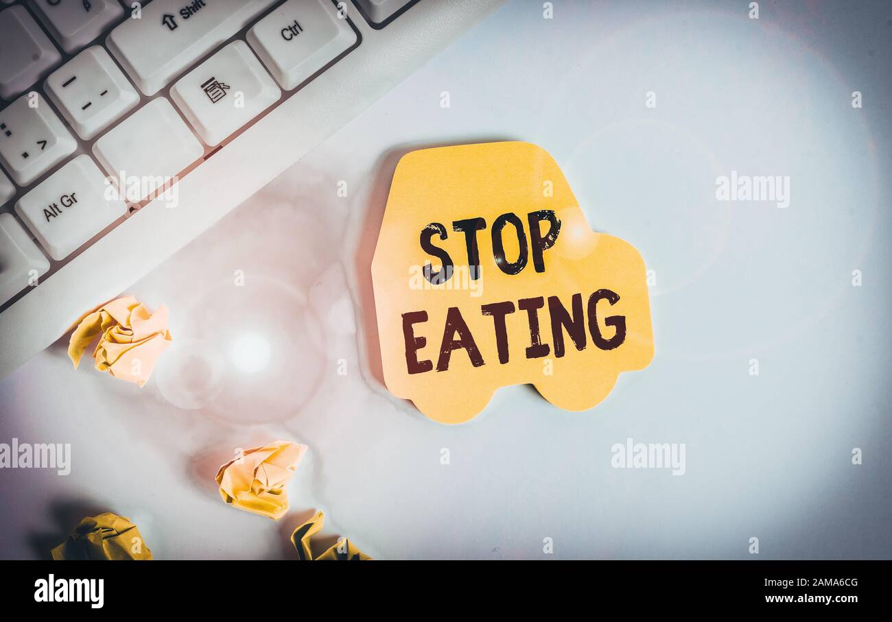 Handwriting text writing Stop Eating. Conceptual photo cease the ...