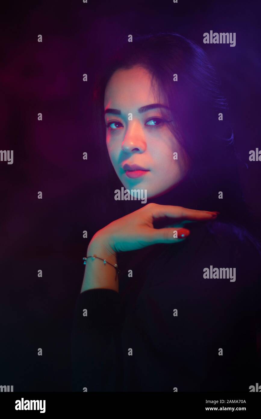 Color light on a female portrait. Neon light Stock Photo - Alamy