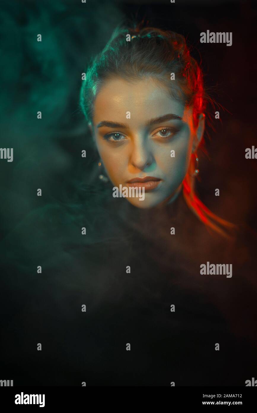 Color light on a female portrait. Neon light Stock Photo - Alamy