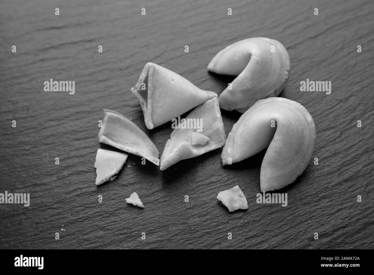 Cracked open chinese fortune cookie Black and White Stock Photos ...