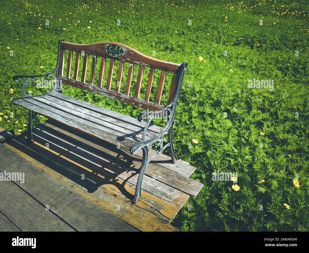 old rustic vintage wooden bench in summer cosmos flowers field ...