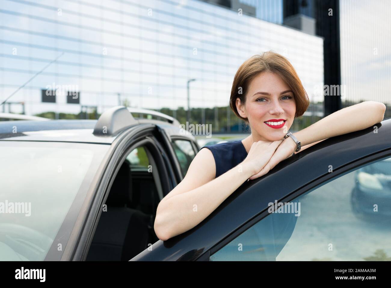 Woman driver gets red automobile hi-res stock photography and images ...