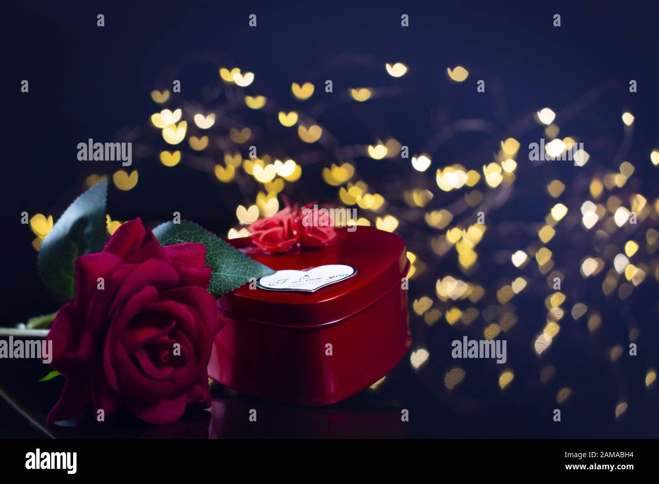 Valentine's Day background. Gifts, red rose, confetti, envelope on ...