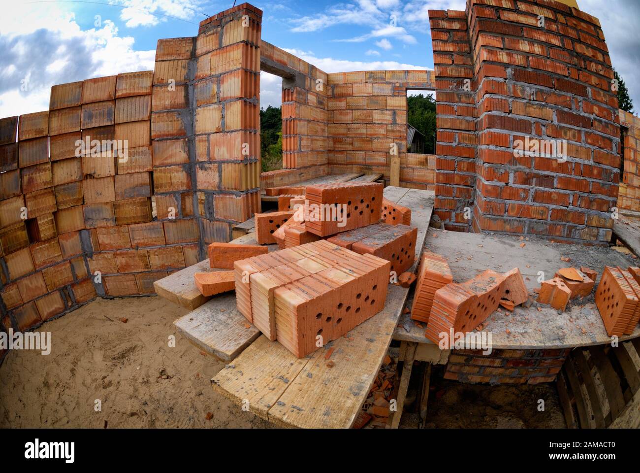 Construction of red bricks house at countryside Stock Photo - Alamy
