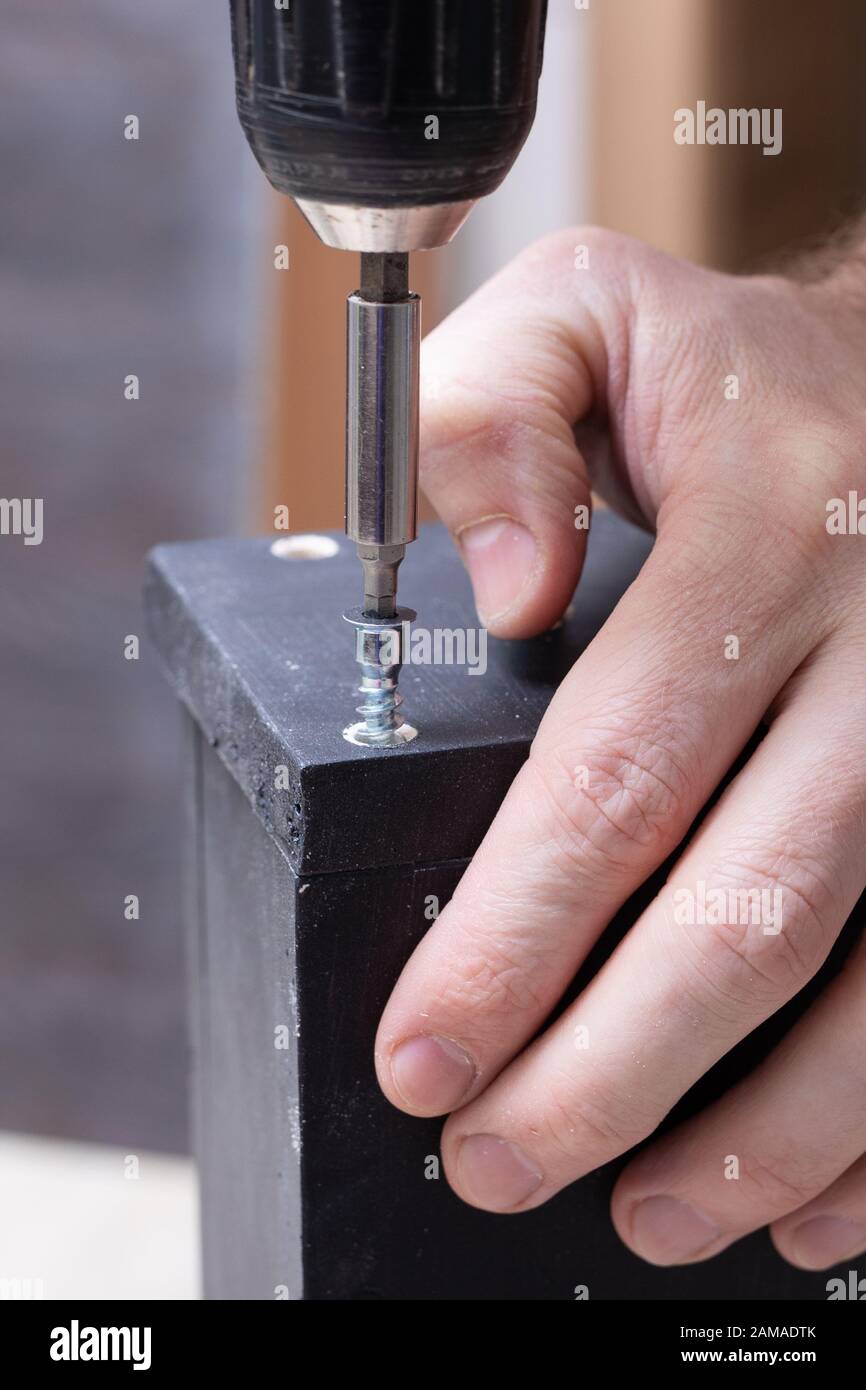 Side view and close up photo of carpenter person with professional ...