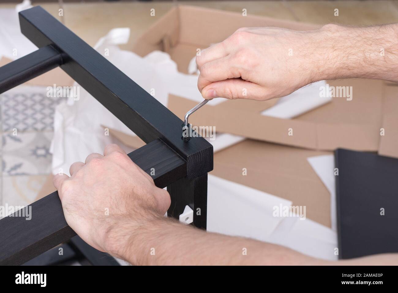 Assembly Of Wooden Furniture Of Dining Chair Close Up Hands Of