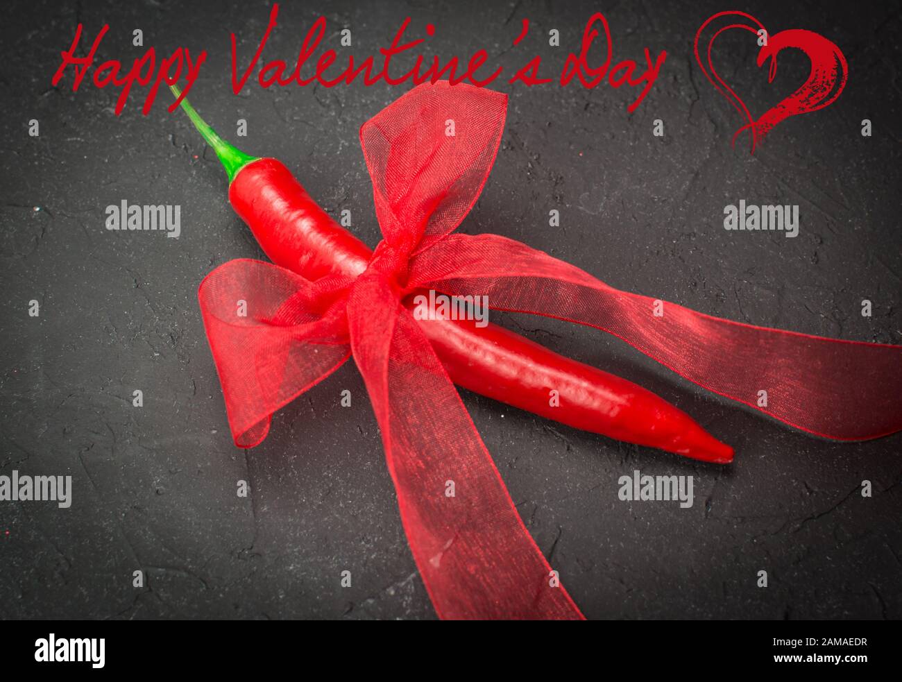 black background with red chilli and text "happy valentine day Stock ...