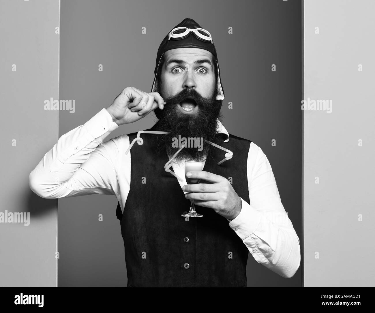 handsome bearded pilot or aviator man with long beard and mustache on ...