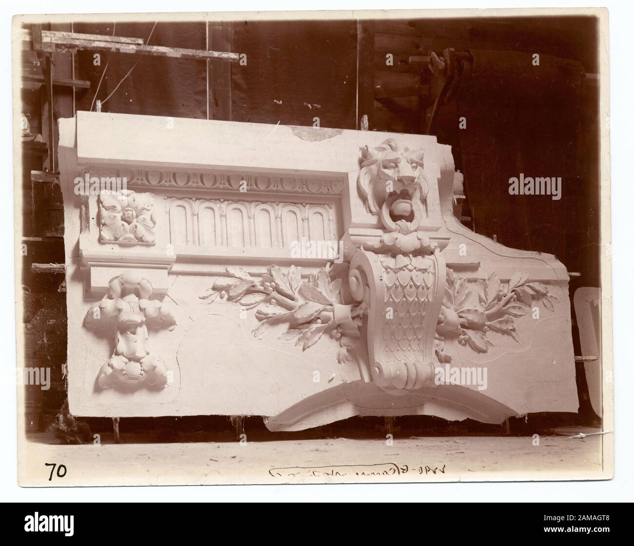 Plaster model of architectural detail above an arch, including moldings ...