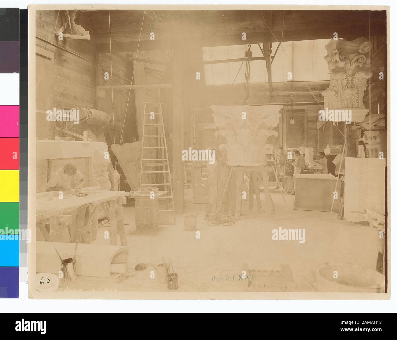 Plaster workshop - men working on models, including a Corinthian ...