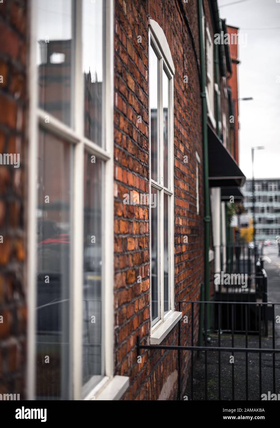 street brick red building in manchester UK city urban Stock Photo - Alamy