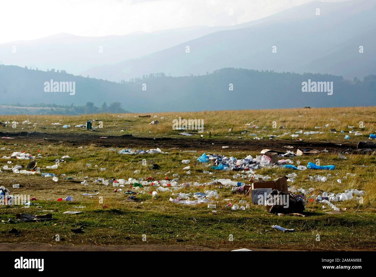 Garbage left behind by tourism on a plateau in the mountains ...