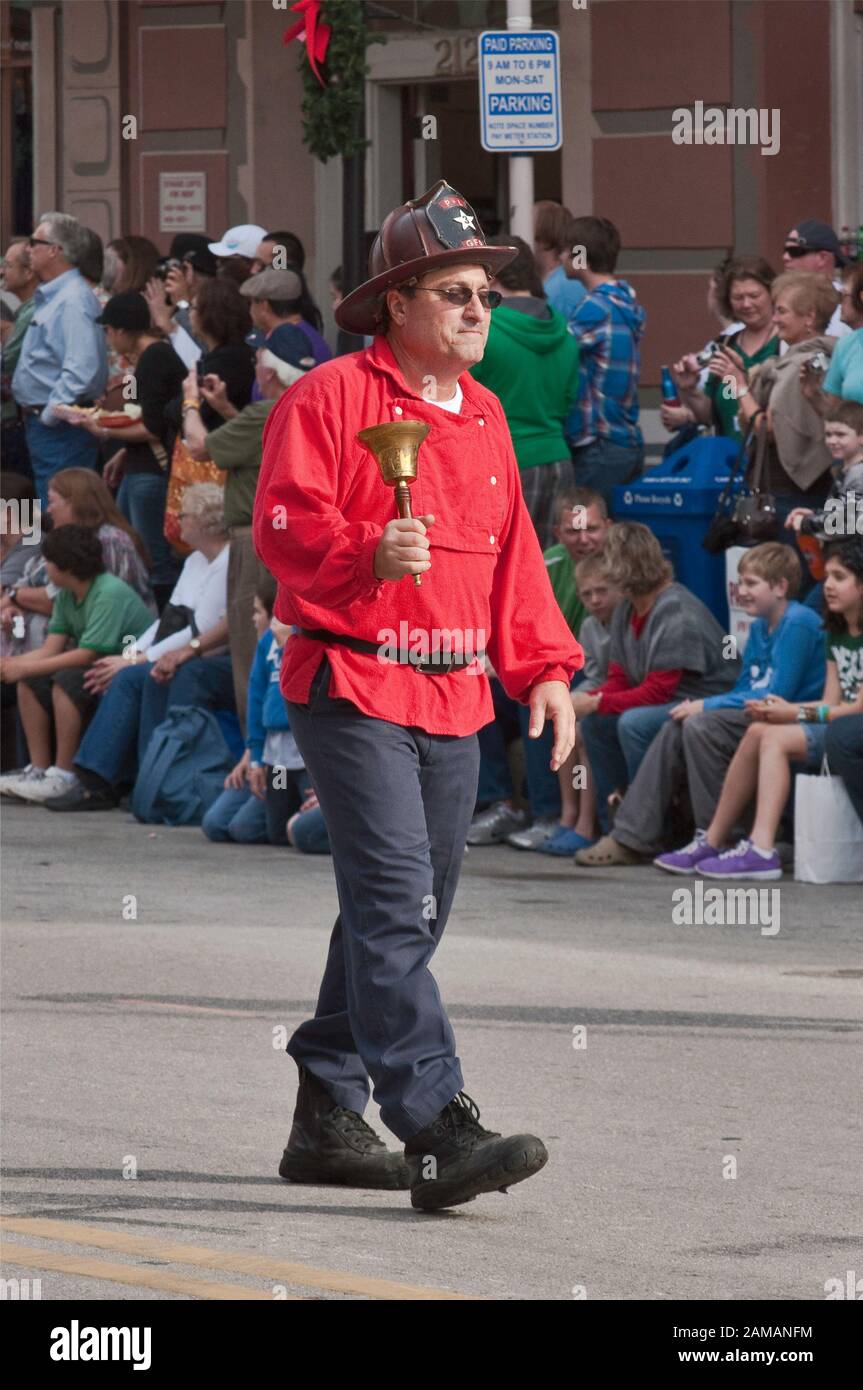 Fireman in traditional costume, ringing a bell, at Dickens on The ...