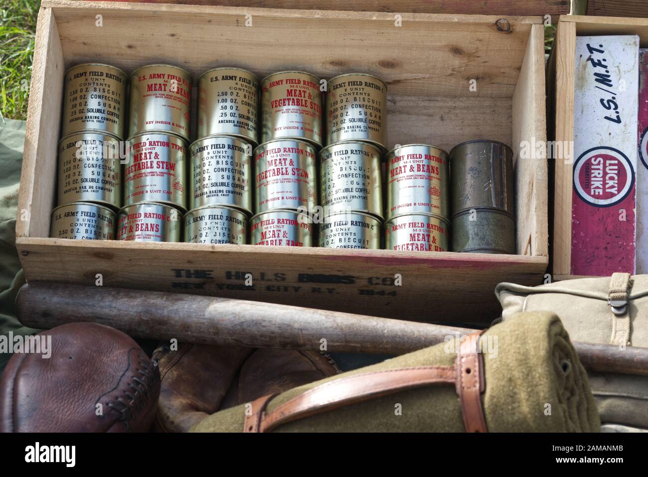 Army field rations, ball and baseball bat in a reenactment of an ...