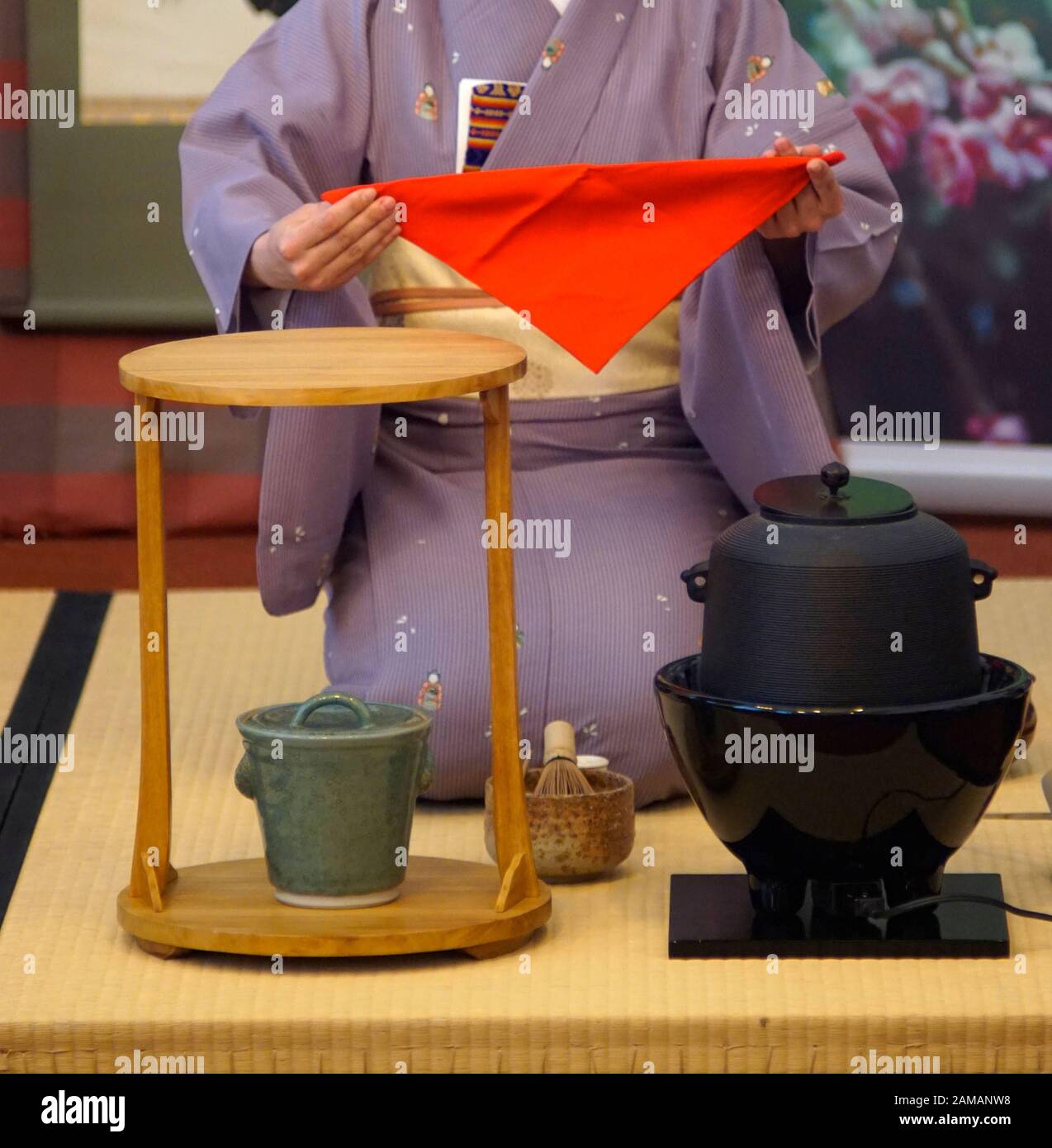 Japanese tea ceremony Chanoyu. Woman dressed in traditional kimono uses ...