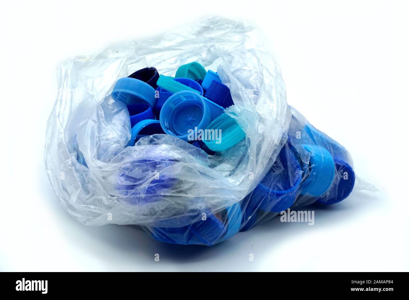 Blue plastic bottle caps sorted by colors in transparent single use ...