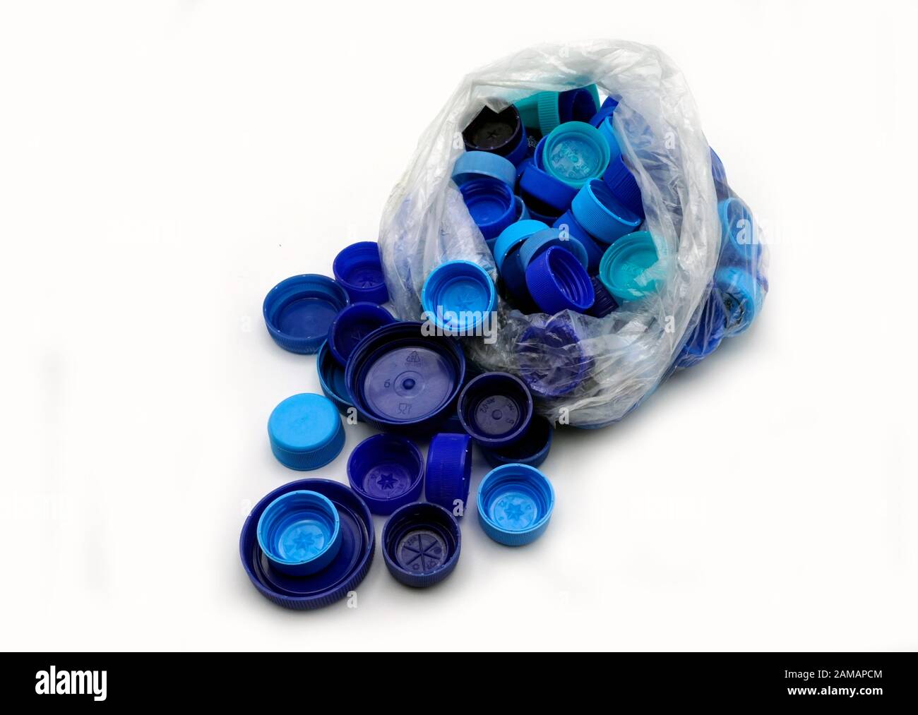 Blue plastic bottle caps sorted by colors in transparent single use ...