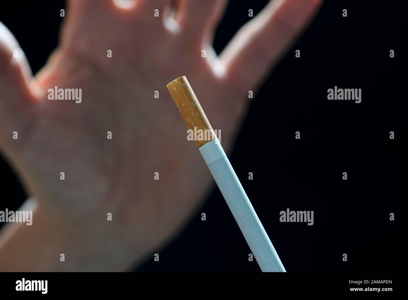 Hand and cigarette Stock Photo - Alamy