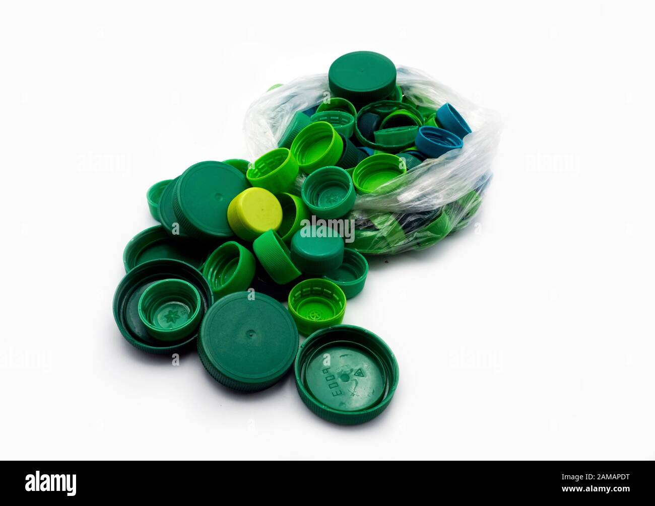 Green plastic bottle caps sorted by colors in transparent single use ...