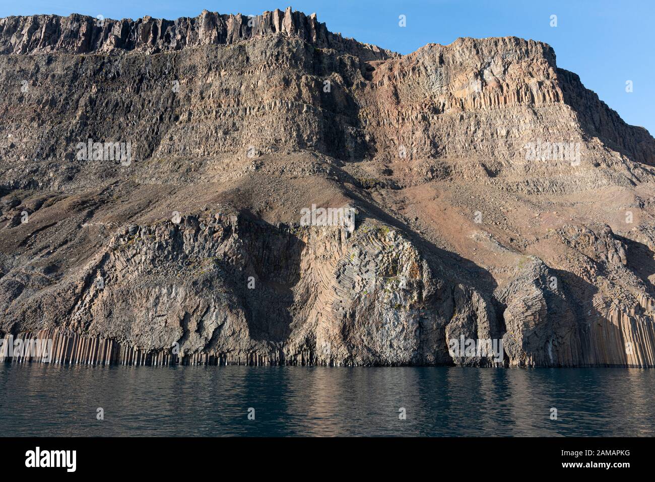 Basalt columns in the rocks in Scoresby Sound, east Greenland Stock ...