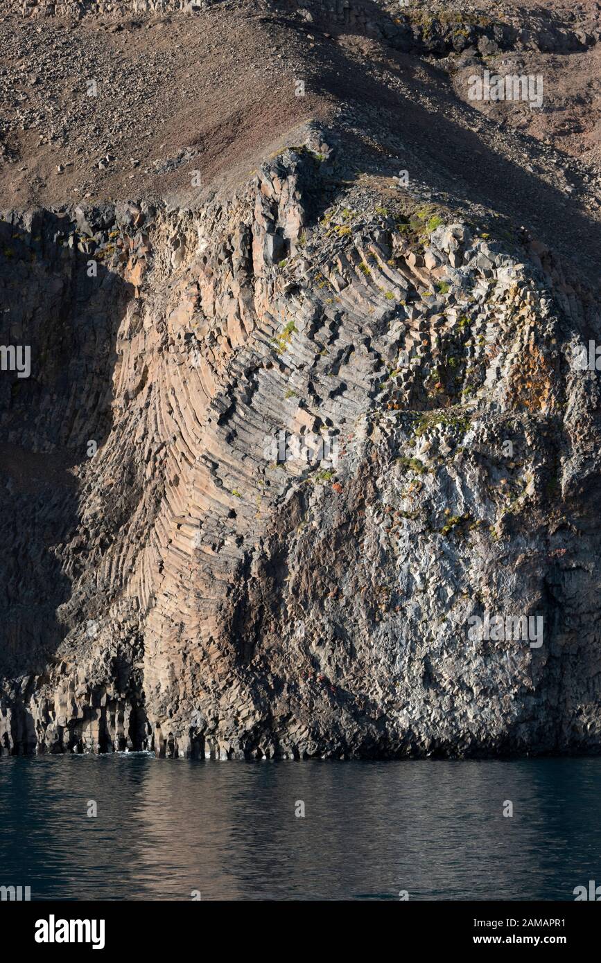 Basalt columns in the rocks in Scoresby Sound, east Greenland Stock ...