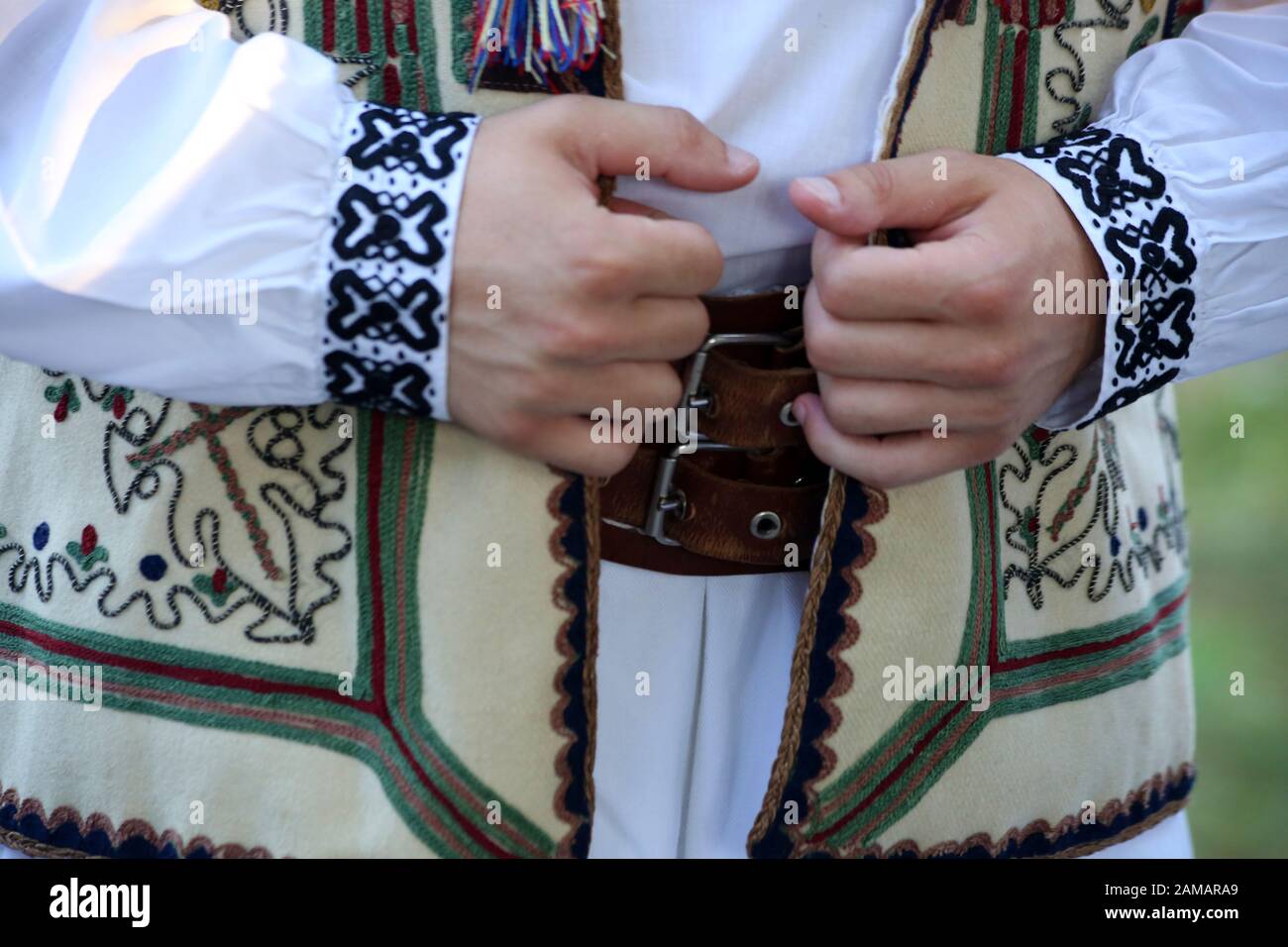 Folklore artist play saxophone wearing beautiful traditional costume ...
