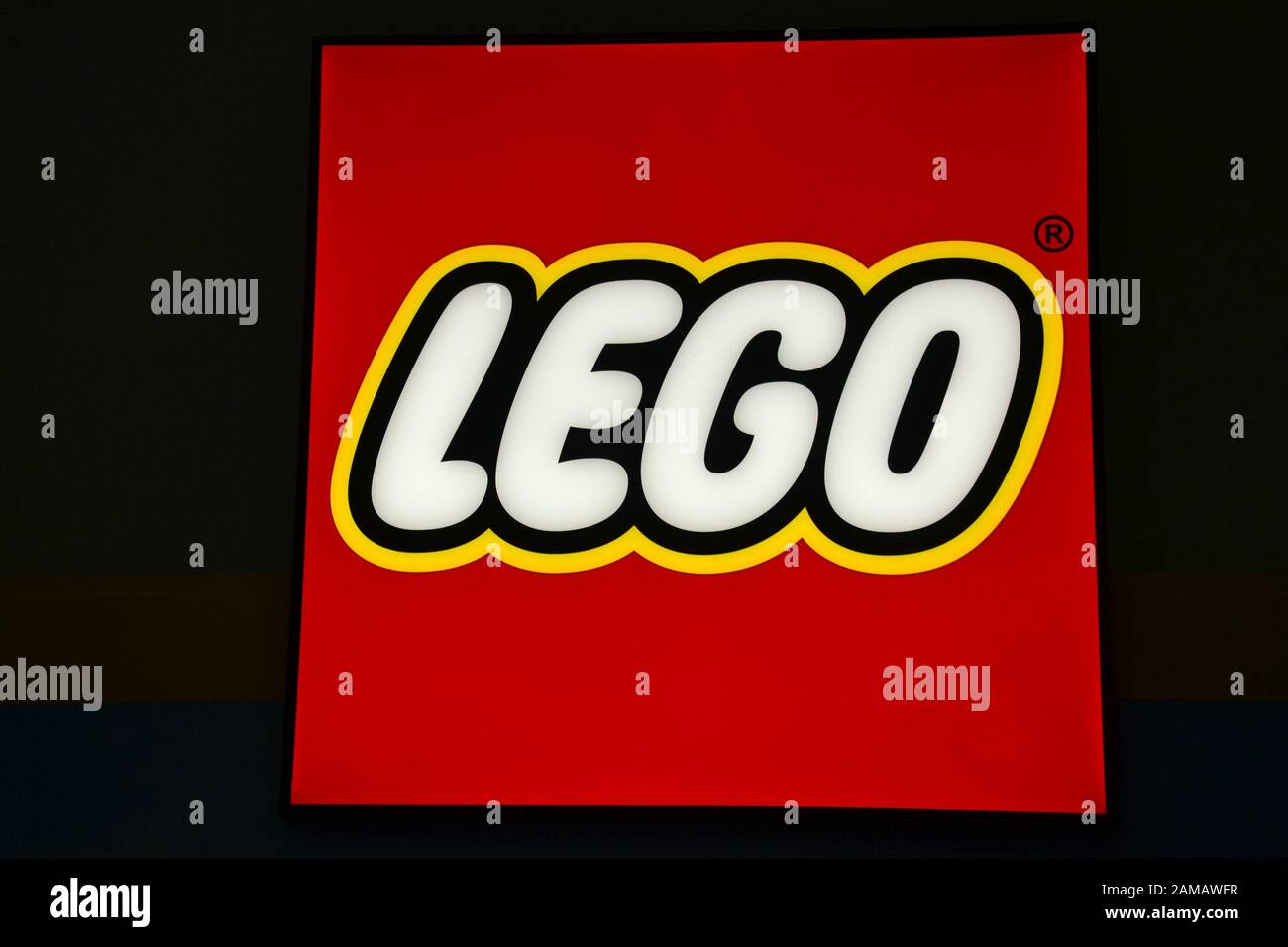 An illuminated Lego sign advertising a toy shop Stock Photo - Alamy