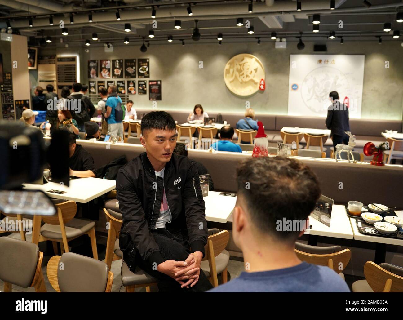 (200112) -- HONG KONG, Jan. 12, 2020 (Xinhua) -- TVB actor Mat Yeung receives an interview at ...