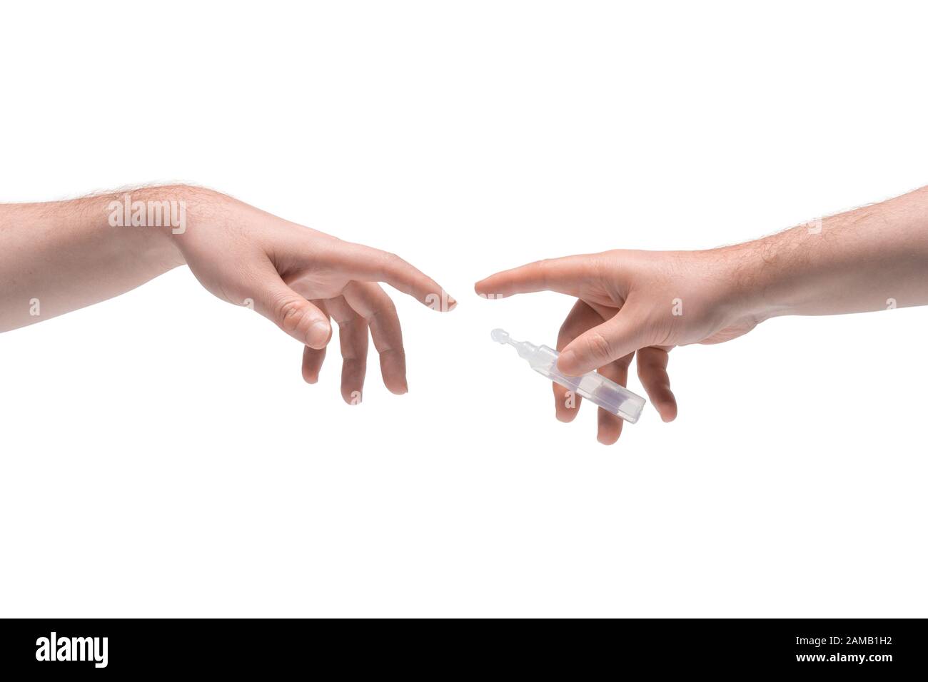 Two male hands passing one another small plastic phial with clear ...