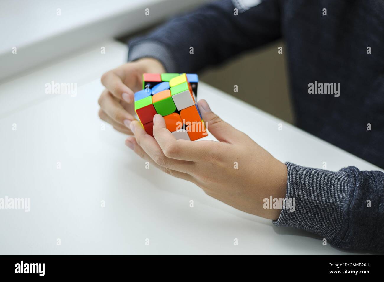 Rubik's cube child hi-res stock photography and images - Alamy