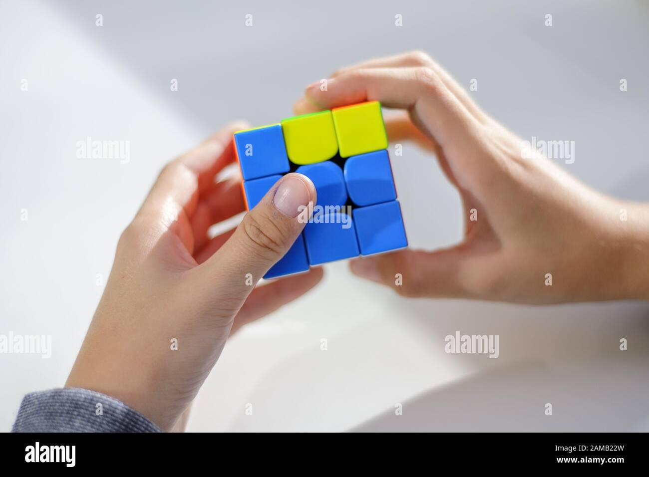 Child solving rubiks cube hi-res stock photography and images - Alamy