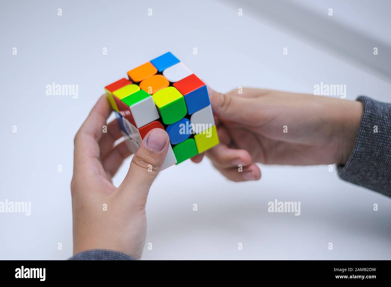 Playing with rubiks cube hi-res stock photography and images - Alamy