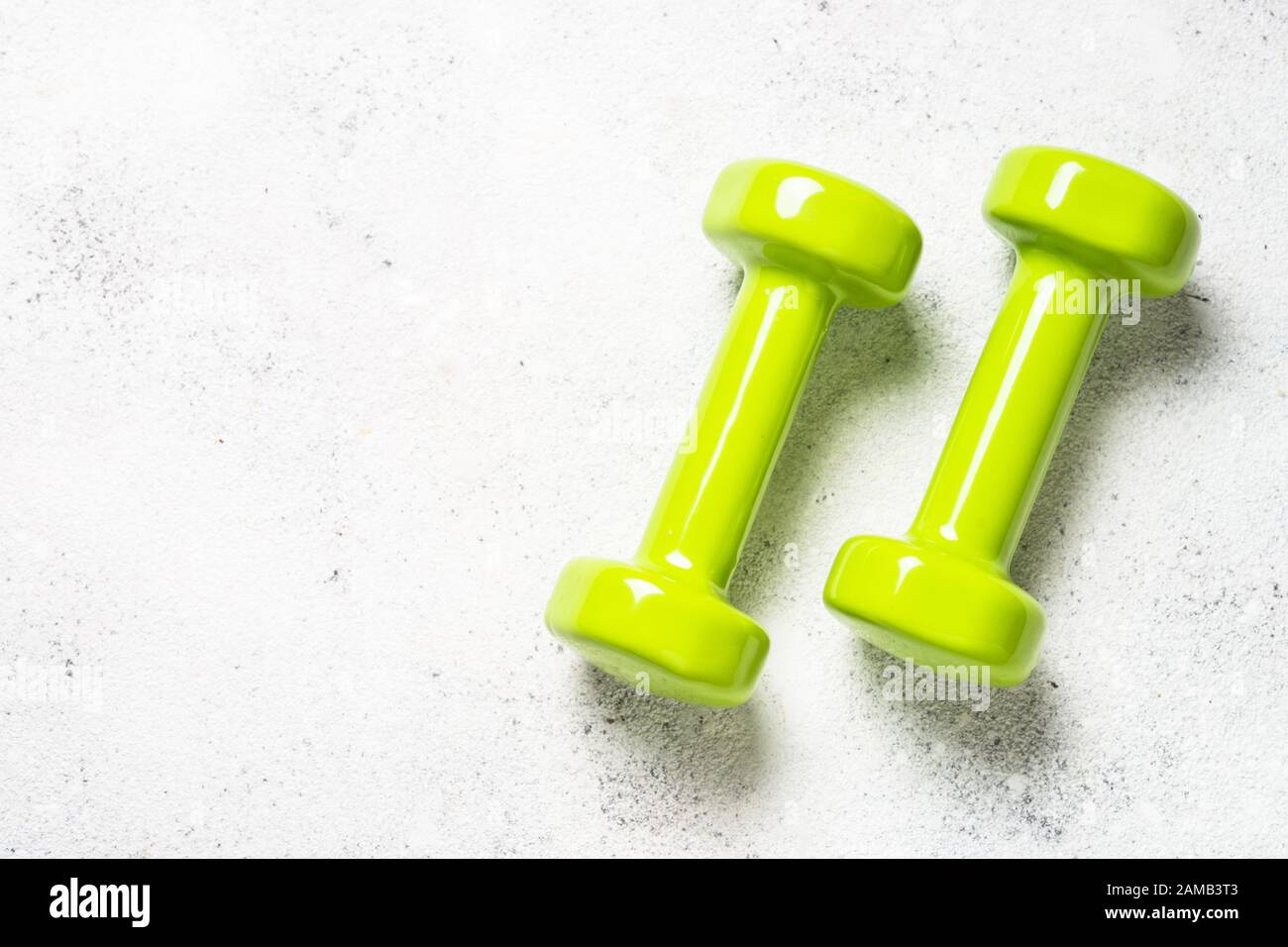 Dumbbells on white background top view Stock Photo - Alamy