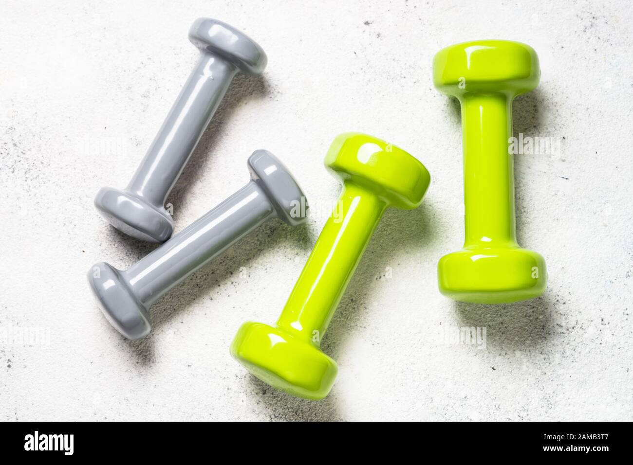 Dumbbells on white background top view Stock Photo - Alamy
