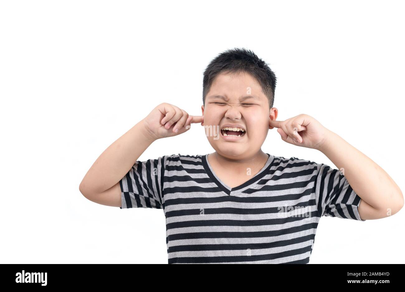 Obese fat boy covering ears ignoring annoying loud noise isolated on ...
