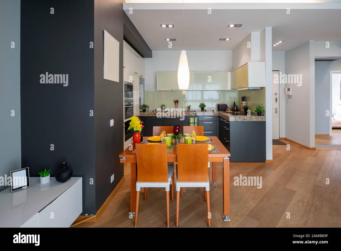 Modern interior of kitchen in studio apartment. Kitchen set. Chairs and ...