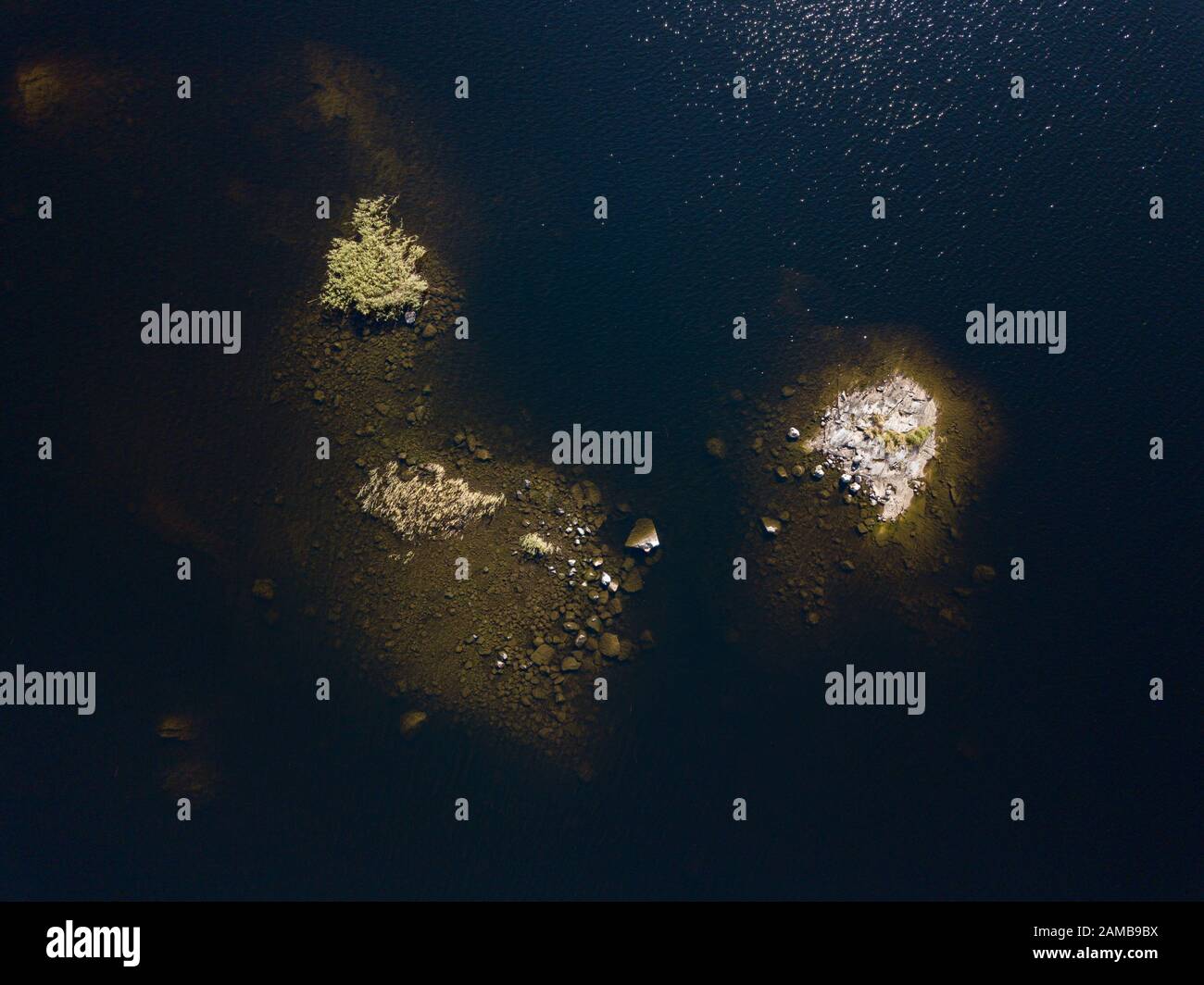 Small islets of stone Stock Photo - Alamy