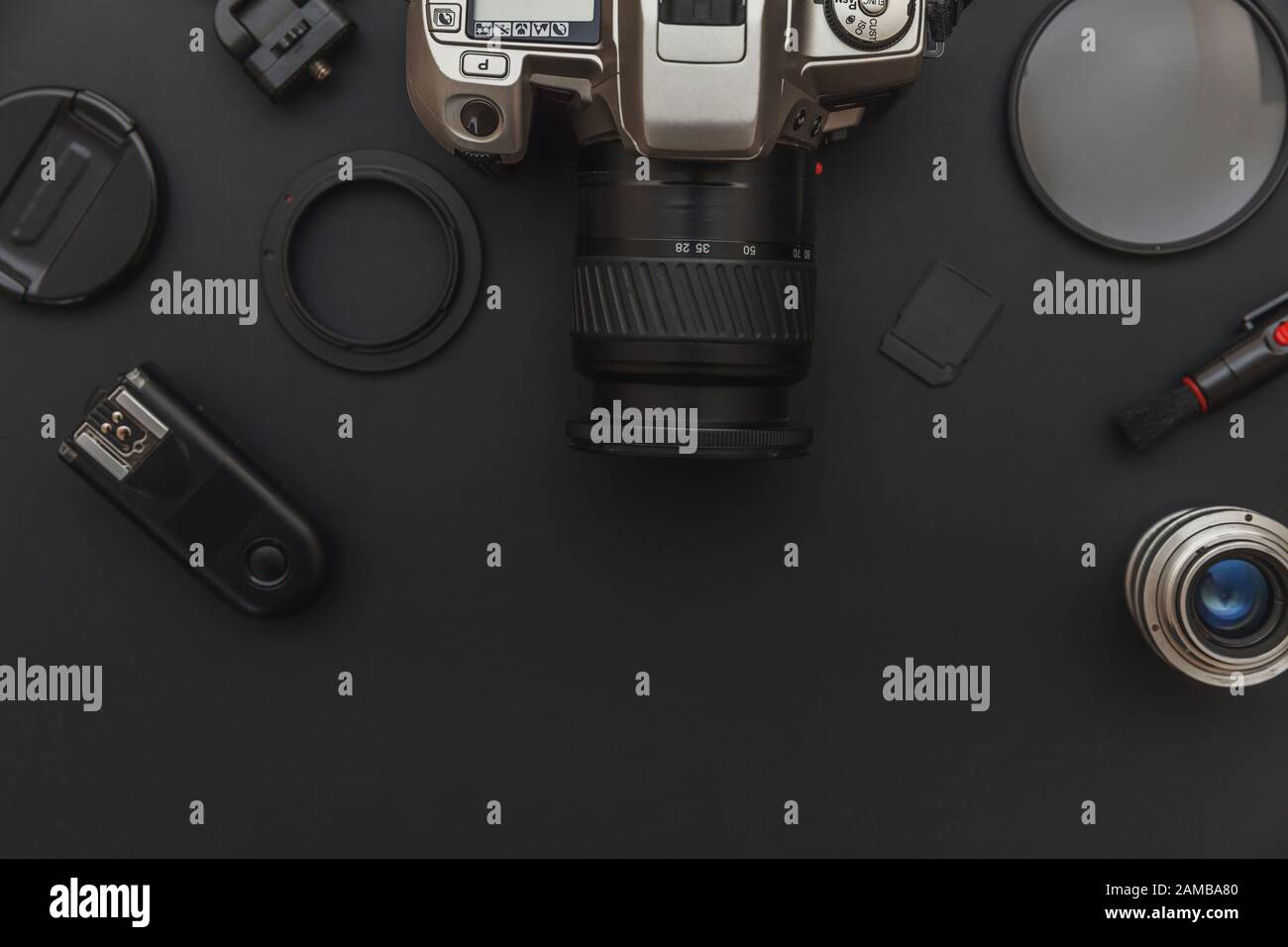 Photographer workplace with dslr camera system, camera cleaning kit ...