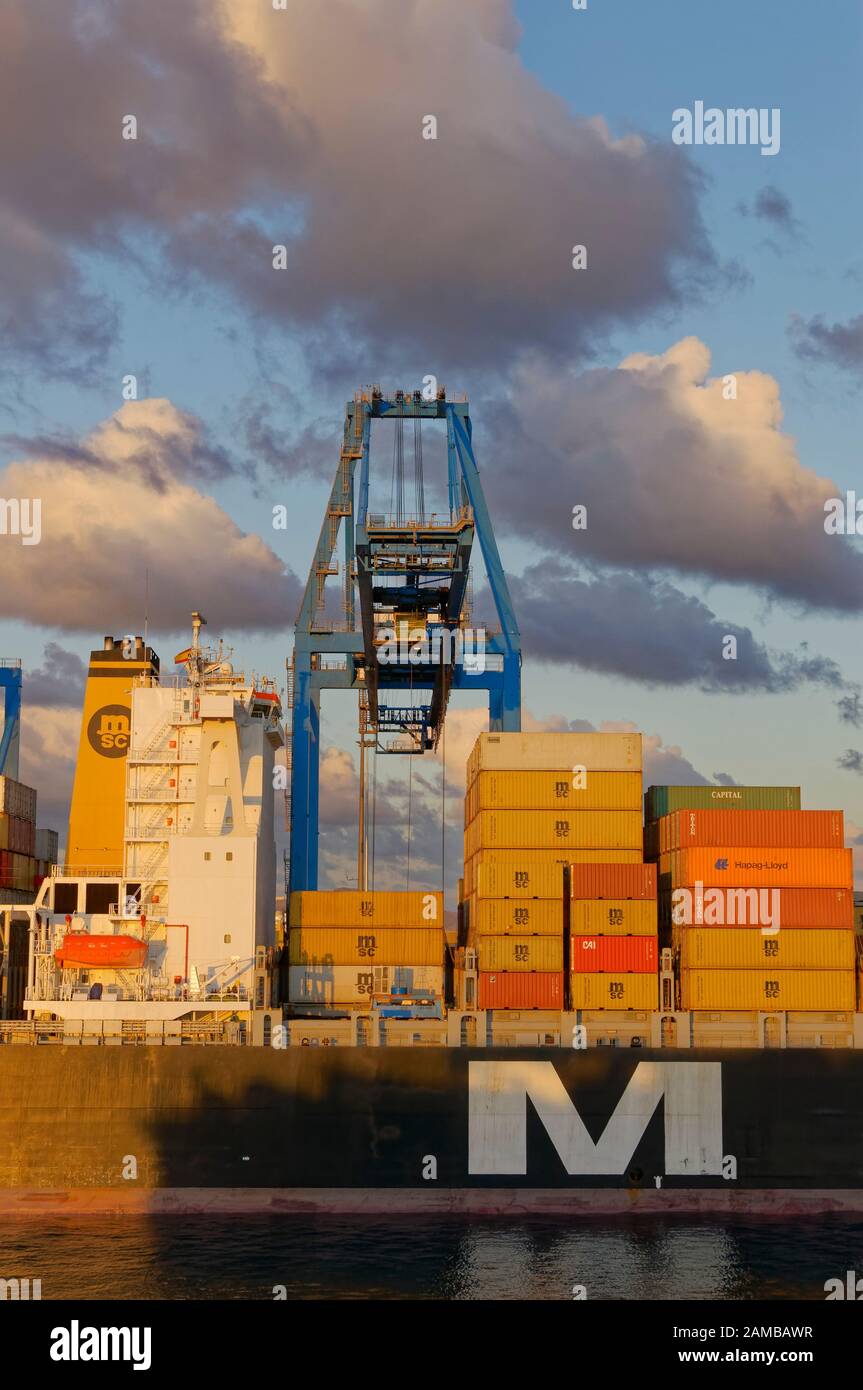 Stacked Shipping Containers on the Wharf waiting to be loaded onto ...
