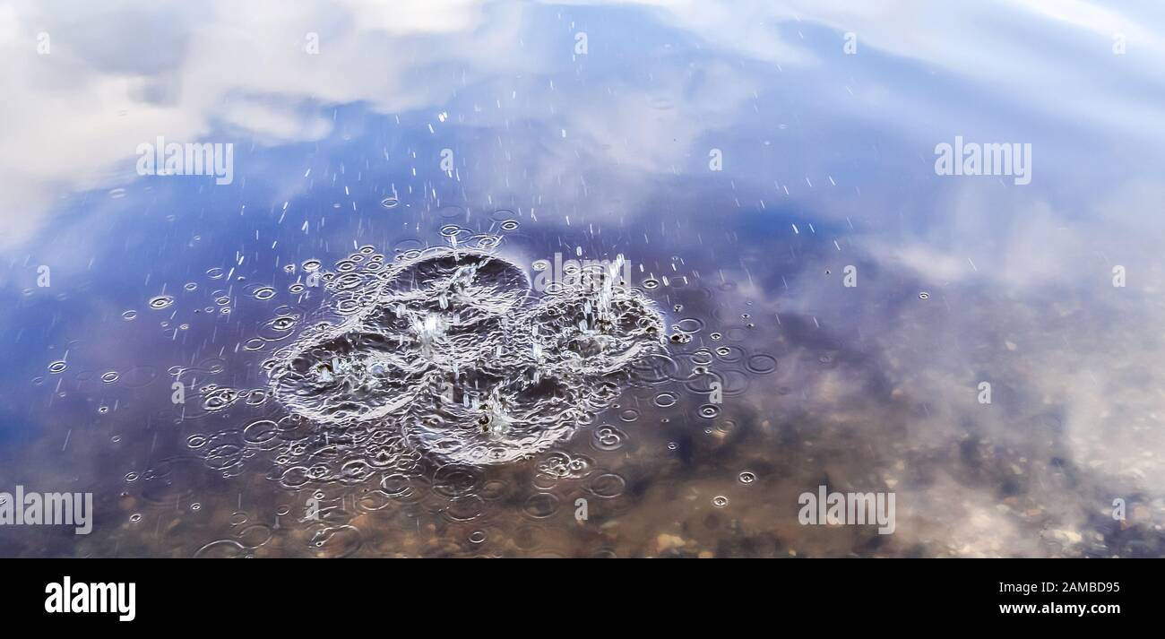 Beautiful water waves and ripples from a drop falling into a water ...