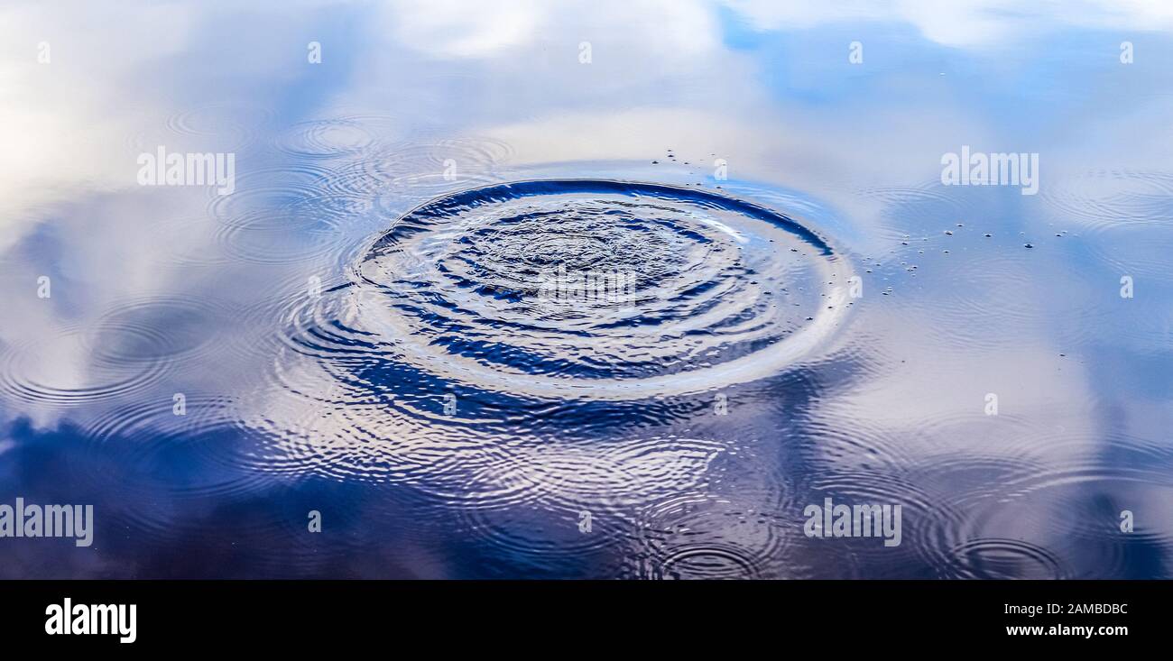 Beautiful water waves and ripples from a drop falling into a water ...