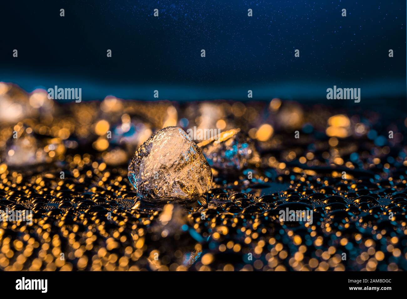 Icy rocks and water droplets under starry night sky - discovery of ...