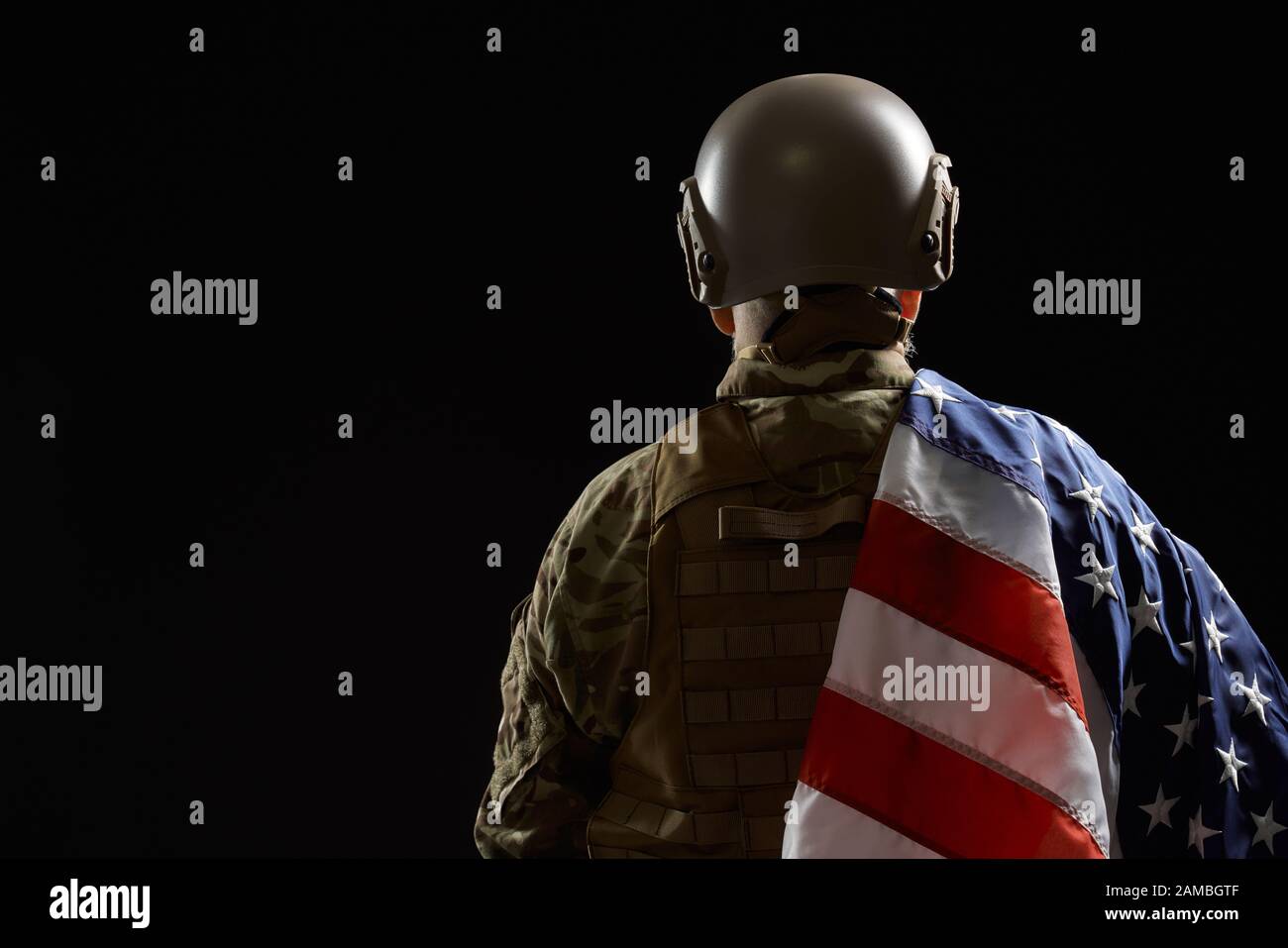 Army man holding usa flag hi-res stock photography and images - Alamy