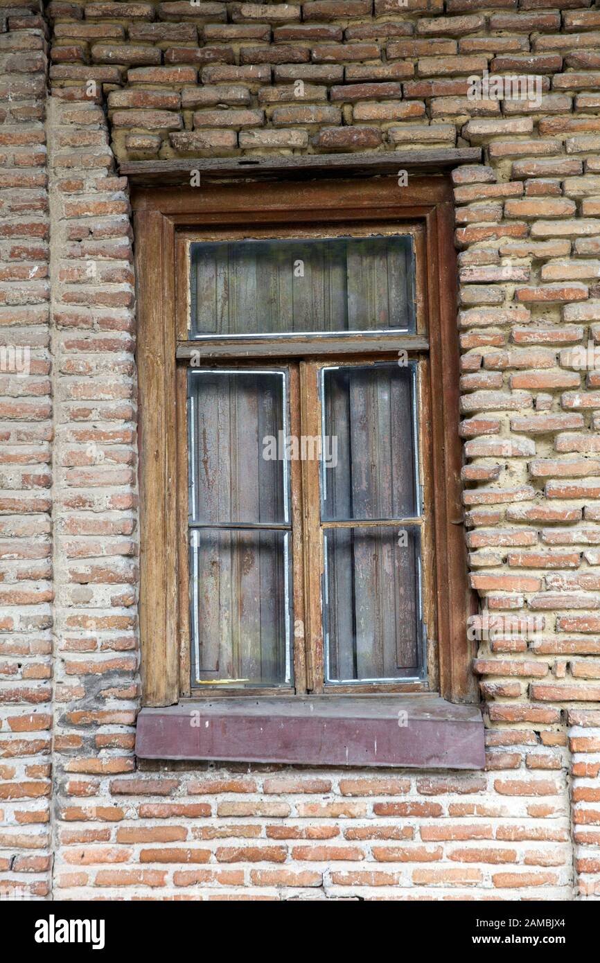 Closeup of the old brick house with wooden windows Stock Photo - Alamy