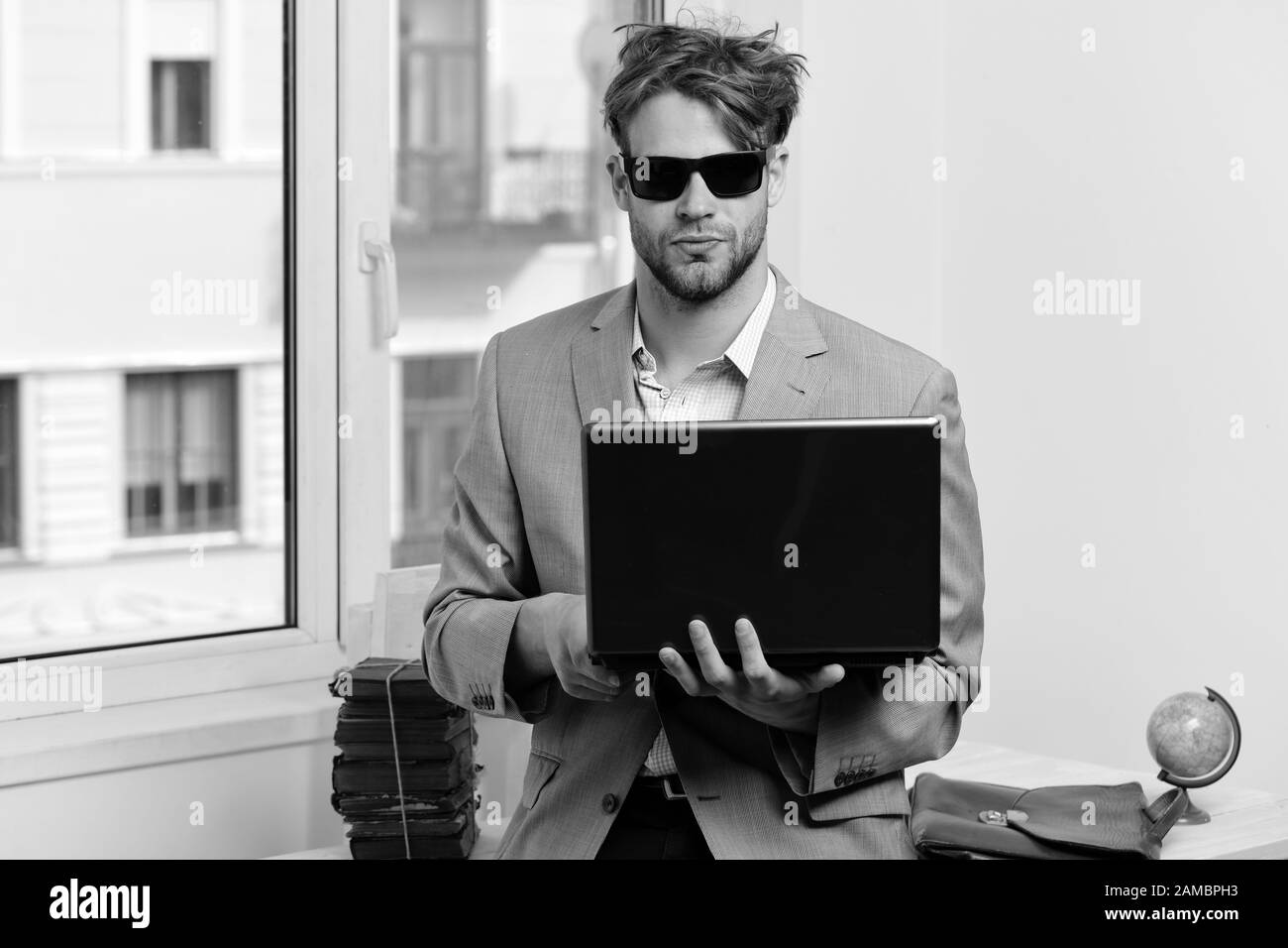 Office employee typing on laptop Black and White Stock Photos & Images ...