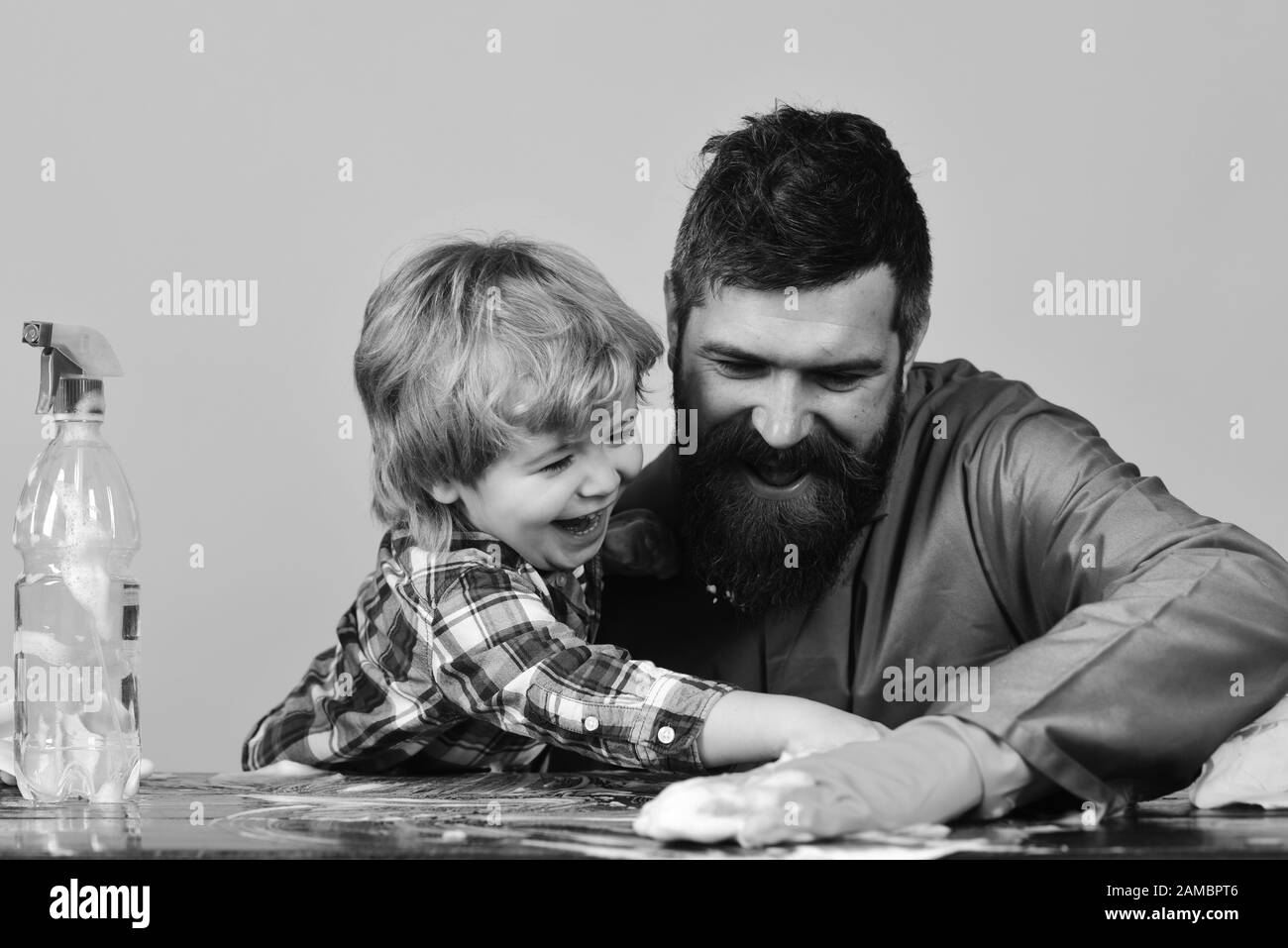 Parents little helper concept. Kid laughing with father on pink ...