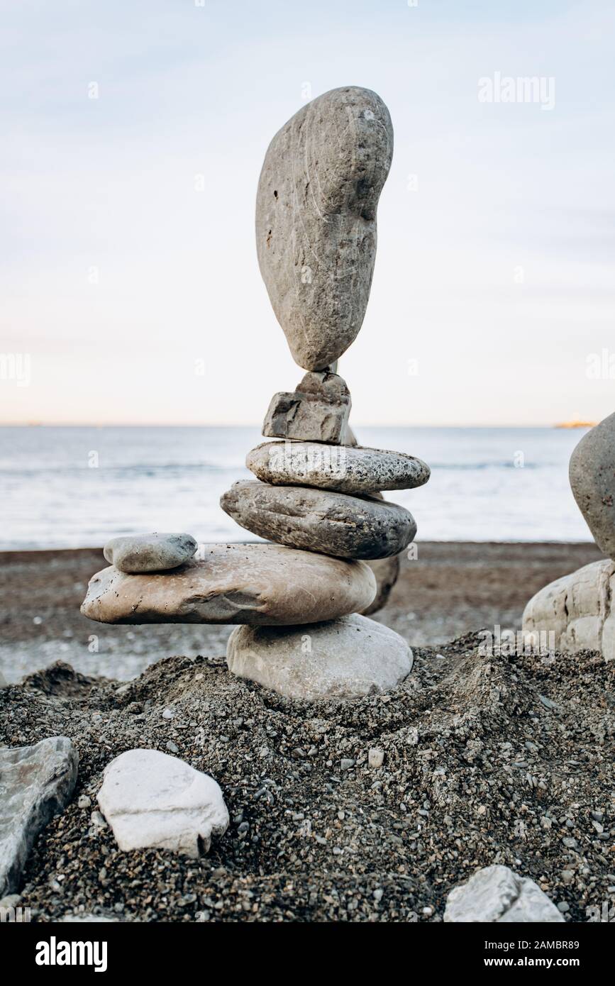 Figures of stones on the beach near the sea. Sea background and stone ...
