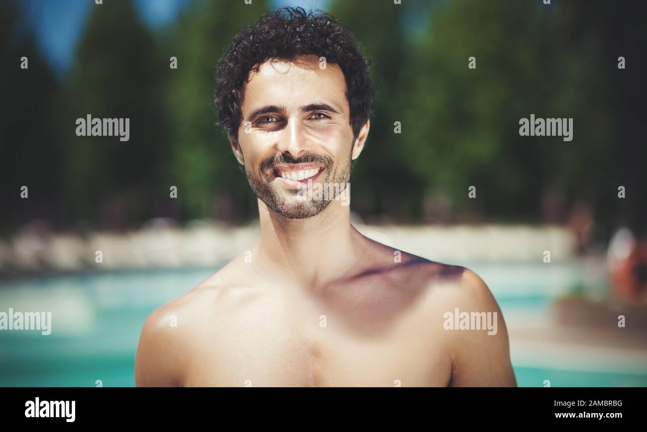 Handsome man enjoying the summer in a swimming pool Stock Photo - Alamy