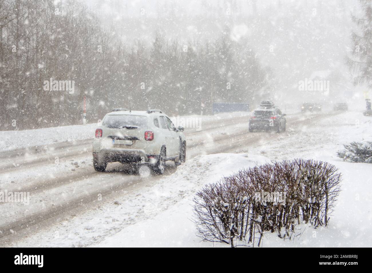 bad winter weather with heavy snow fall and traffic problems in ...