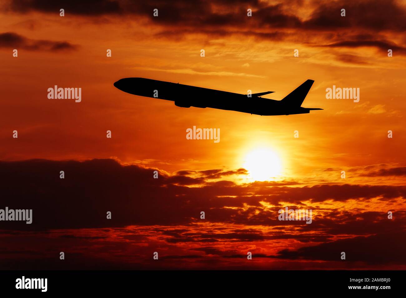 Airplane In The Sky At Sunset. Travel background with passenger plane ...